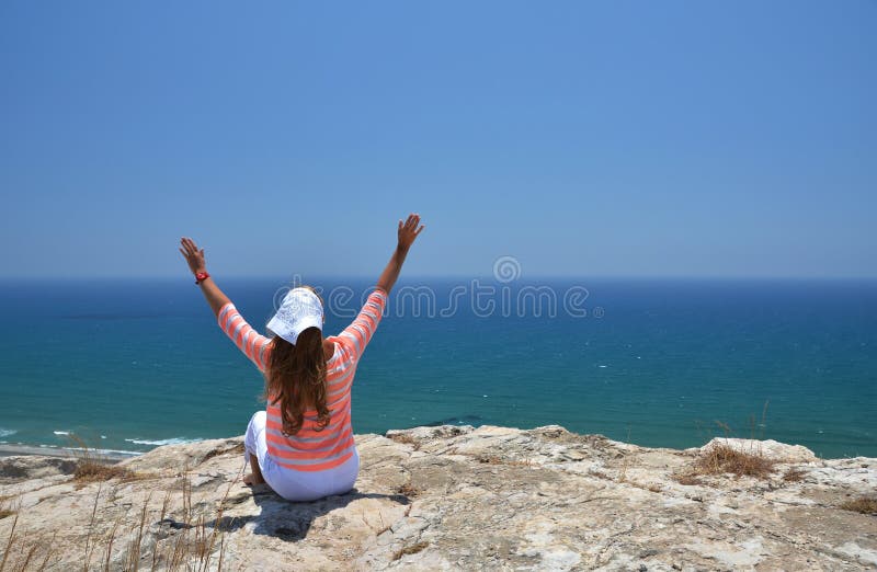 Girl on the Rock Looking To the Ocean Stock Image - Image of climbing ...