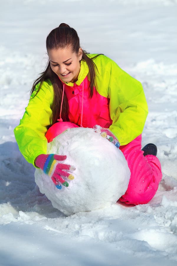 Girl Rolling a Huge Snowbal Stock Photo - Image of outside, cloves ...