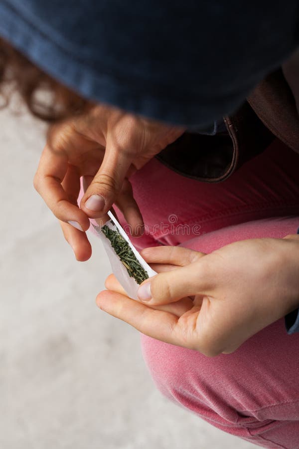 Girl rolling a joint stock image. Image of hands, drug - 34867597
