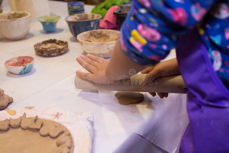 Girl Rolls the Clay in the Studio Stock Photo - Image of layers, maker ...