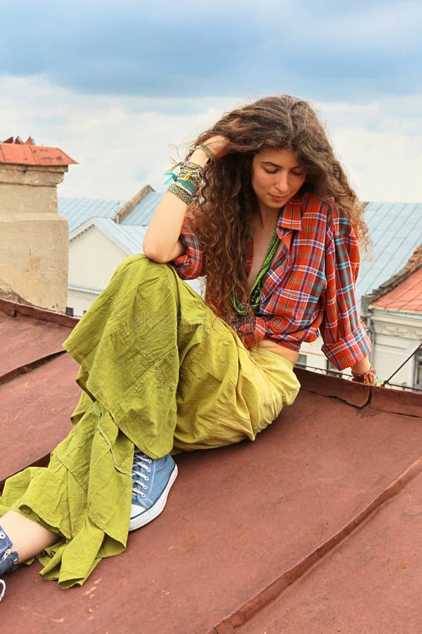 Girl on a roof stock image. Image of cloudscape, long - 11481619