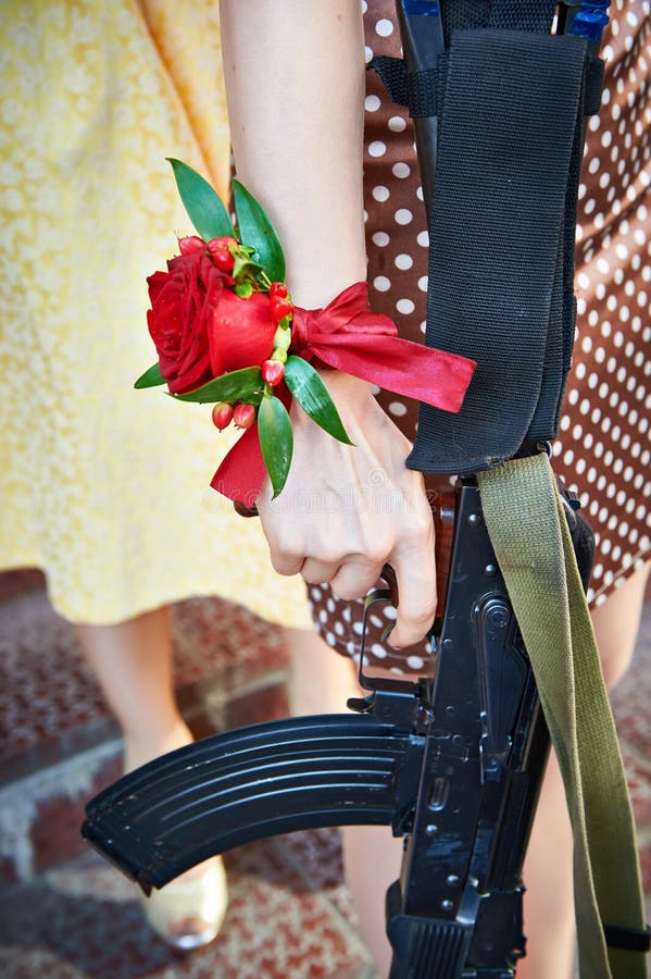 Girl With Rose On Her Hand Holding Machine Gun Stock Image - Image of ...