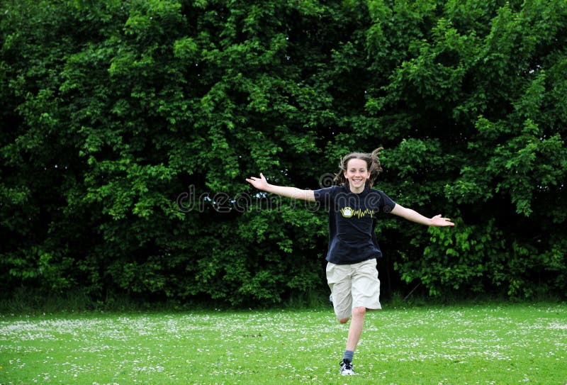 Girl Running with Arms Outstretched Stock Image - Image of arms, field ...