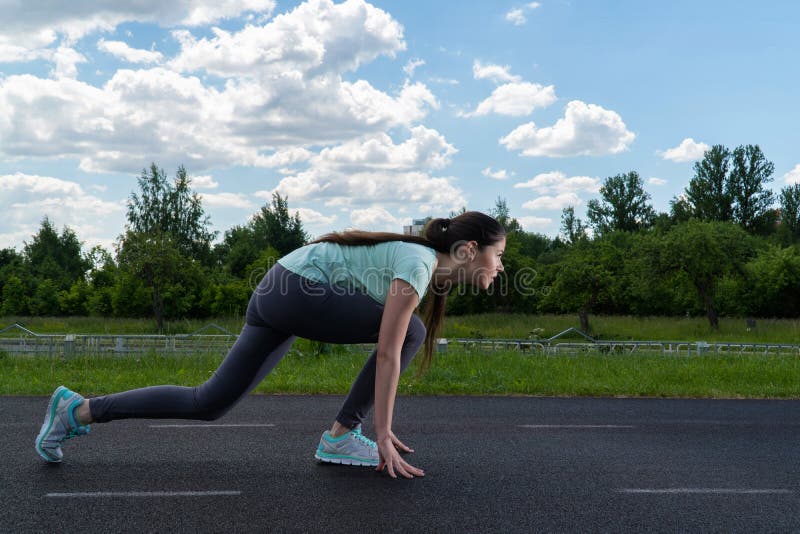 The Girl is Running Around the Stadium. Training Outdoors Stock Photo ...