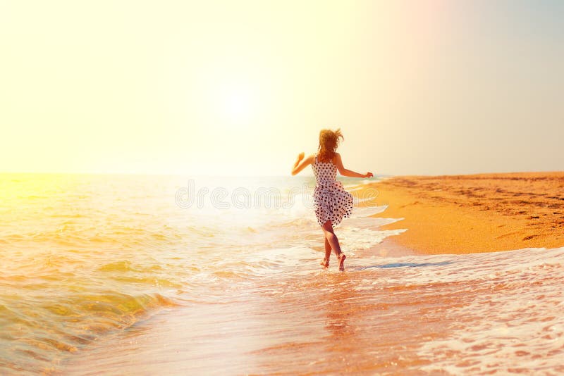 Girl running on the beach stock photo. Image of beautiful - 54380374