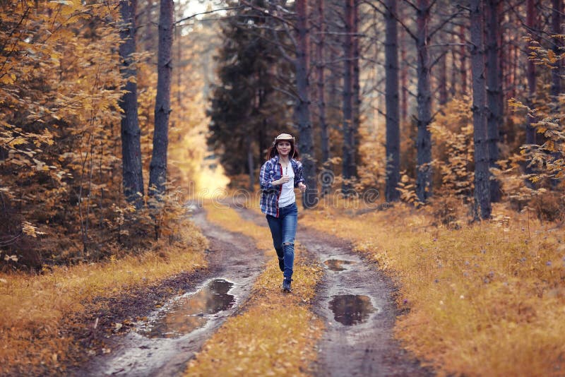 Girl running in forest stock photo. Image of hipster - 64112416