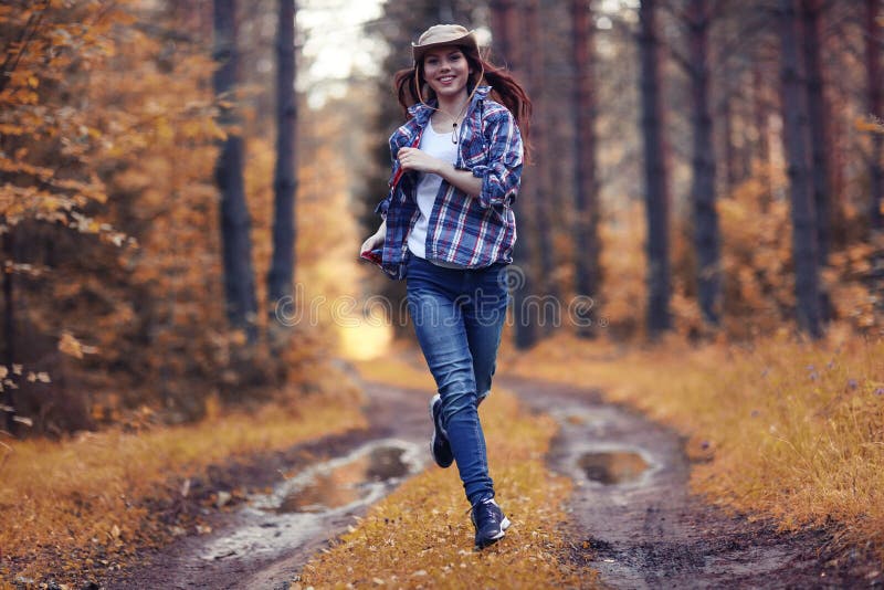 Girl running in forest stock photo. Image of jogging - 64112420