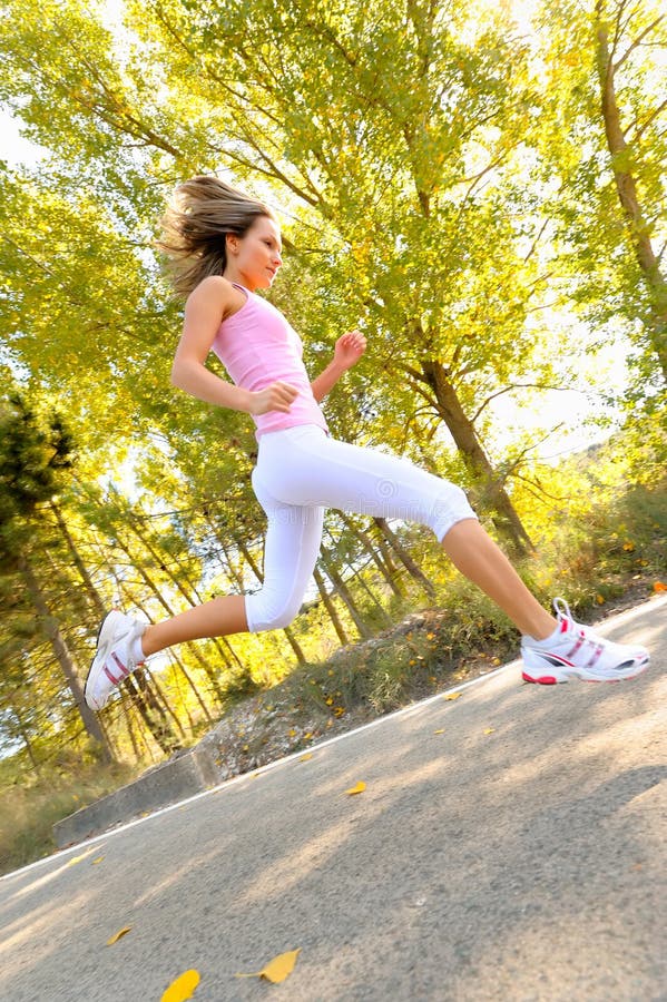 Woman running stock photo. Image of alone, girl, runner - 1100052