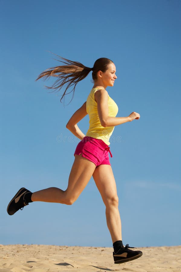 Girl running on sand stock photo. Image of teenage, energetically - 5869350