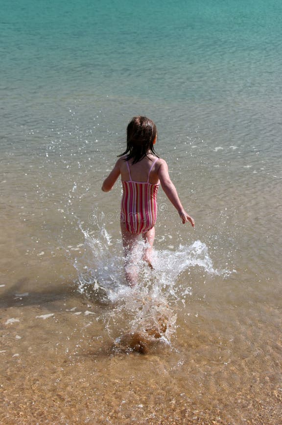 Girl Running into the Water Stock Photo - Image of white, sunny: 162414