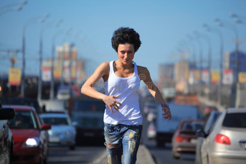 Girl Runs on Highway Middle in City Stock Image - Image of motion ...