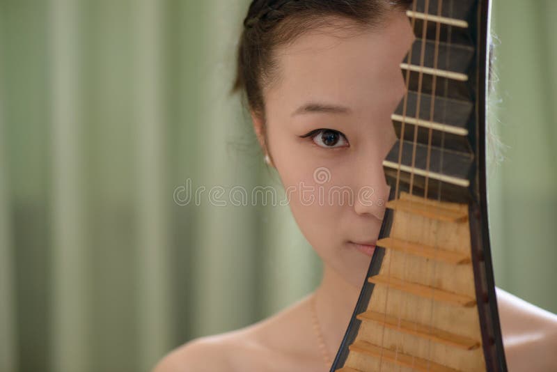 Girl s face behind Pi-pa stock image. Image of model - 30884283