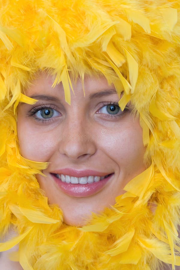 Girl S Face In A Frame Of Yellow Feathers Stock Image Image Of Lips