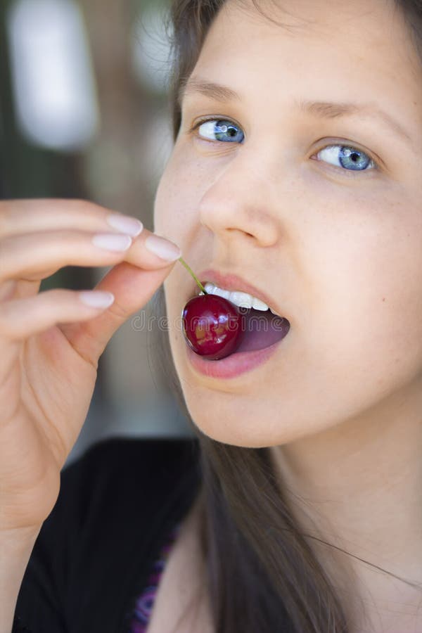 Girl S Face and a Hand with a Red Cherry Stock Photo - Image of fresh ...
