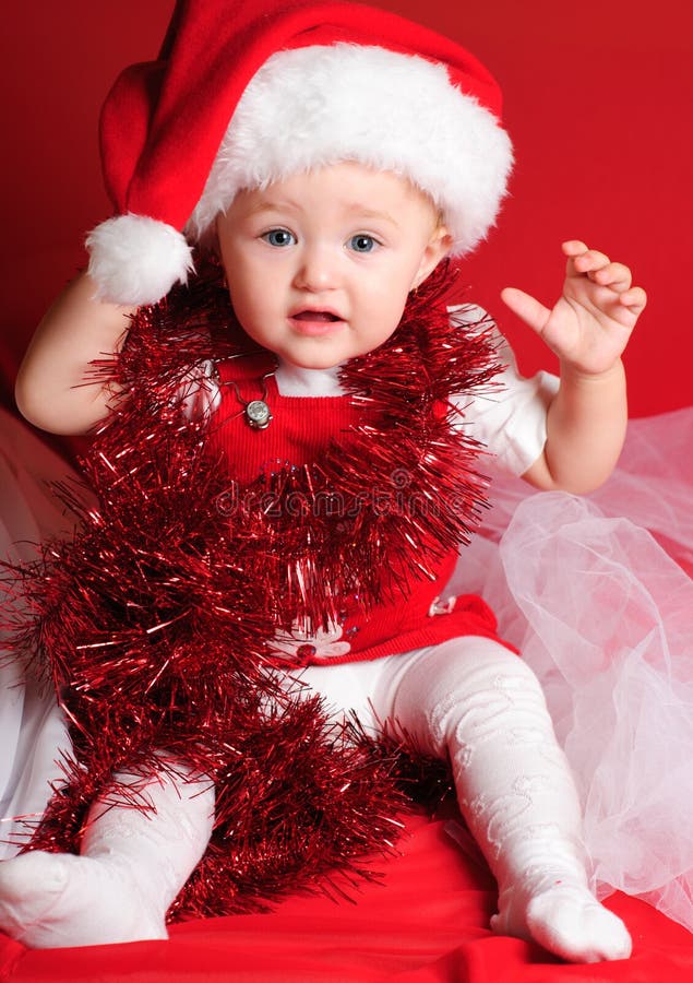 Girl santa on red cloth stock image. Image of season - 17202373