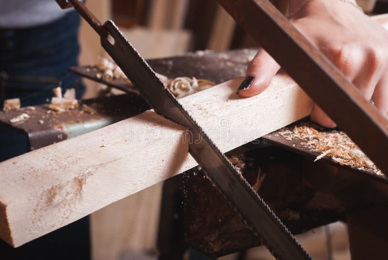 The girl sawing lumber, stock image. Image of woman, occupation - 76071497