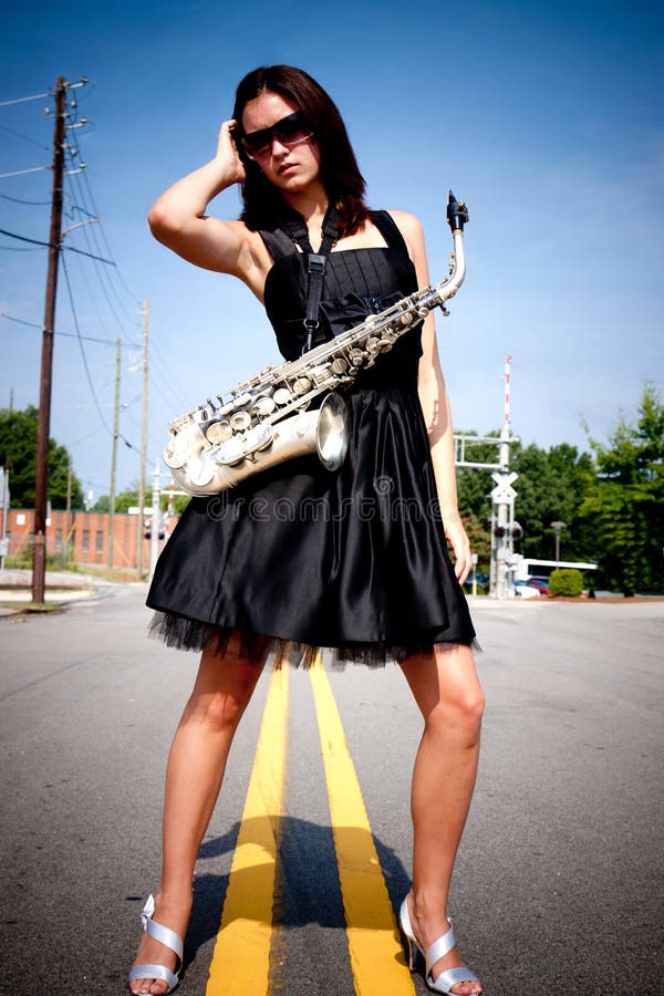 Girl with Sax in Street stock image. Image of adult, concert - 15492969