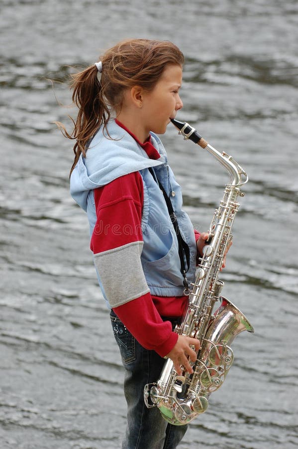 Girl Playing Tenor Saxophone Stock Image - Image of dark, teens: 14534083