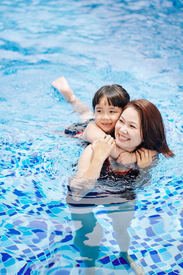 Girl scared of swimming stock photo. Image of mother - 199311192