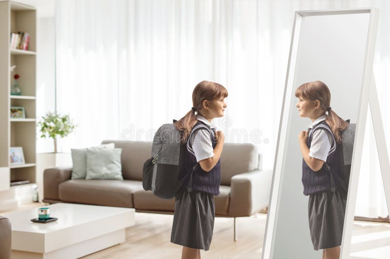 Girl in a School Uniform Getting Ready in Front of a Mirror Stock Photo ...