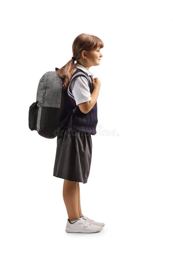 Girl in a School Uniform Standing with a Backpack on Shoulders Stock ...