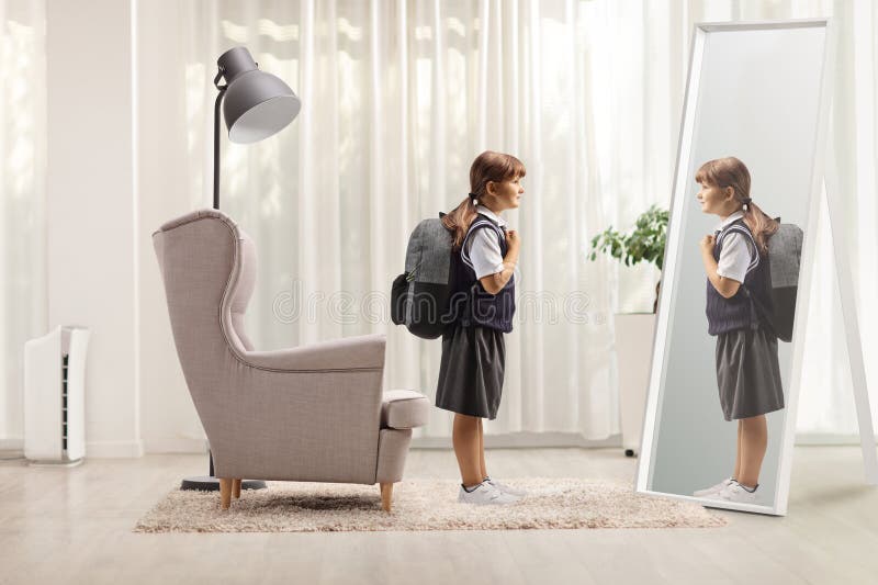 Girl in a School Uniform Standing in Front of a Mirror Stock Image ...