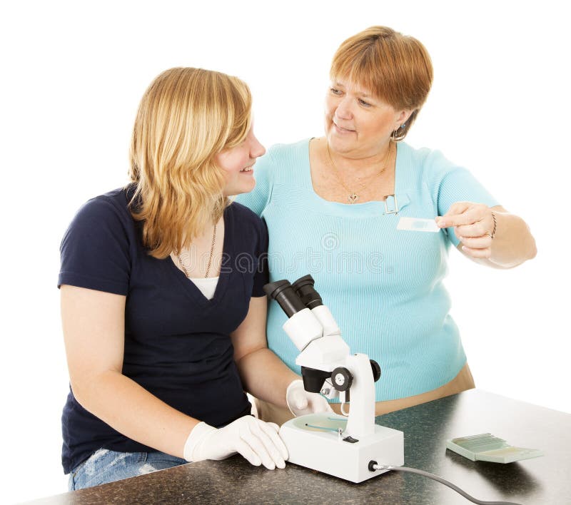 Girl with Science Teacher stock image. Image of microscope - 14188477