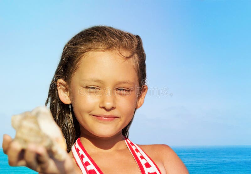Girl and seashell stock image. Image of leisure, positive - 53182489