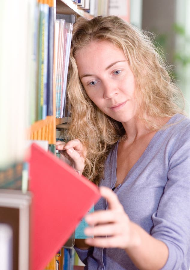 Girl Selecting Book from a Bookshelf Stock Image - Image of college ... Girl Selecting Book from a Bookshelf Stock Image - Image of college ...
