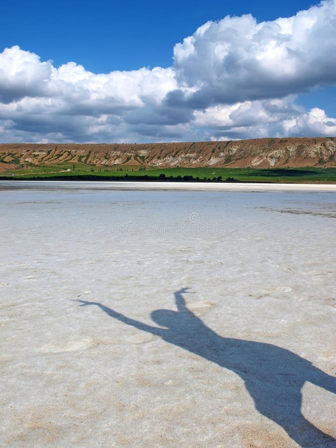 Girl shadow on a salt lake stock image. Image of shadow - 16289579