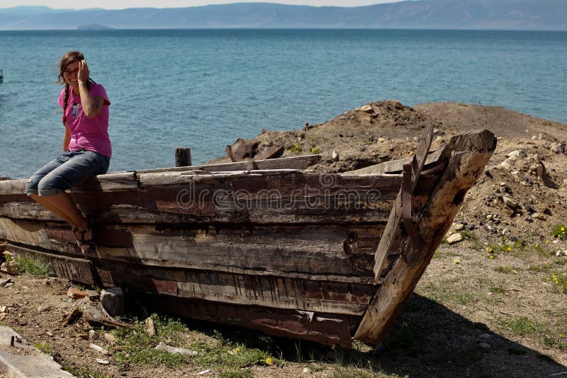 Girl on shipwrecked boat stock photo. Image of youthful - 24616562