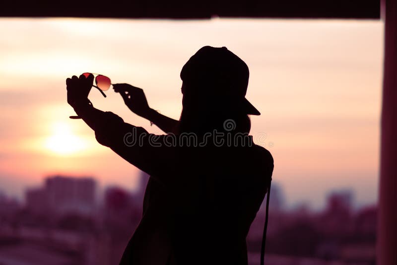 Girl Shooting Backlit Looking through Solar Glasses Stock Image - Image ...