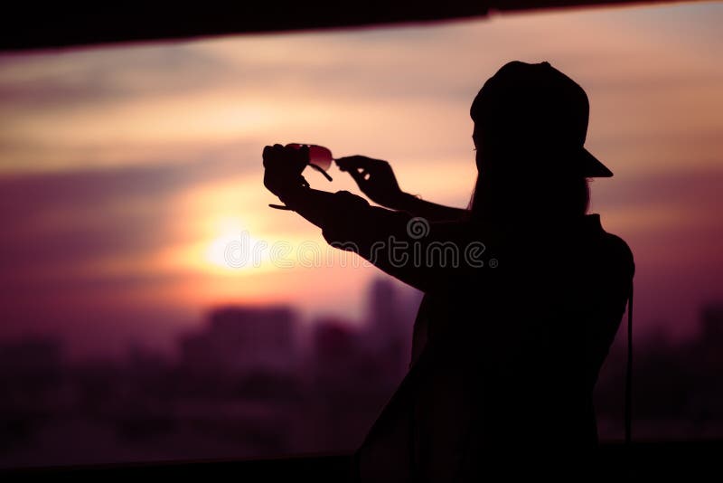 Girl Shooting Backlit Looking through Solar Glasses Stock Image - Image ...
