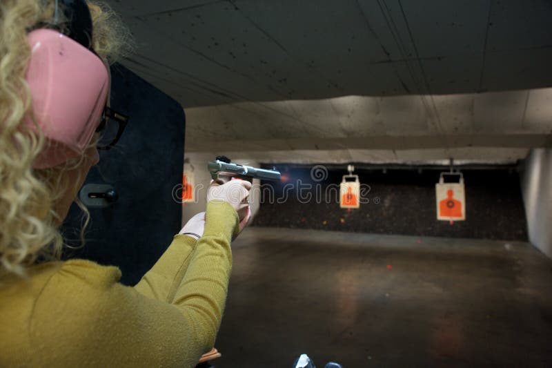 Girl shooting gun stock photo. Image of targets, fire - 28235044