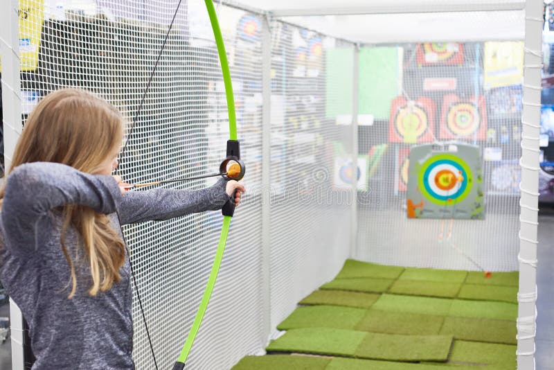 Girl Shoots Bow in Children`s Shooting Range Stock Photo - Image of ...