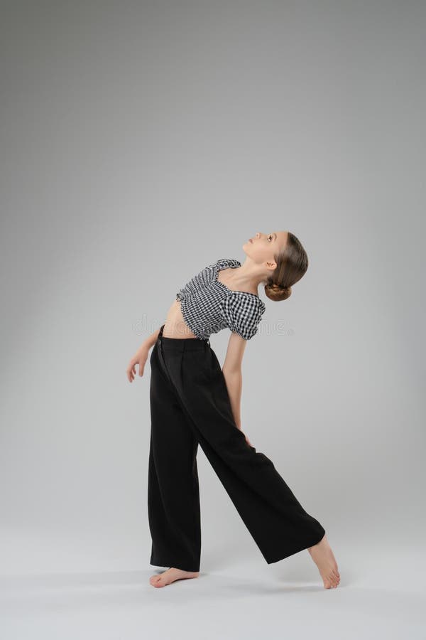 Girl Showcasing Dance Movements with Grace and Style during a Studio ...