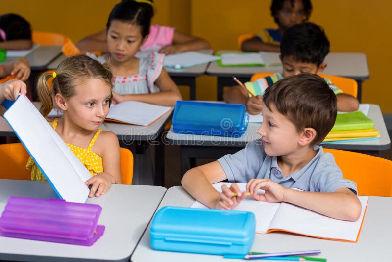 Girl Showing Book To Classmate Stock Image - Image of female, caucasian ...