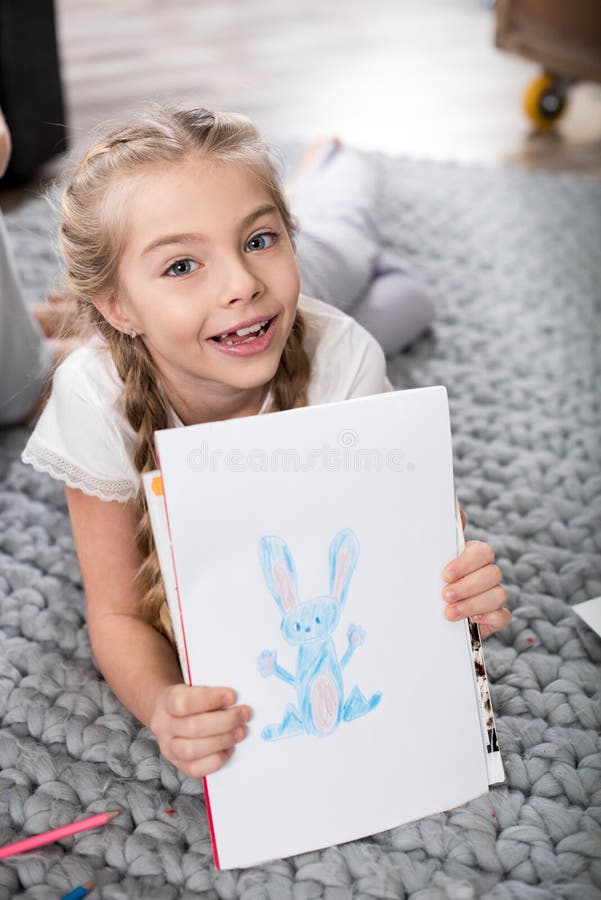 Girl showing drawing stock photo. Image of showing, detail - 90083150