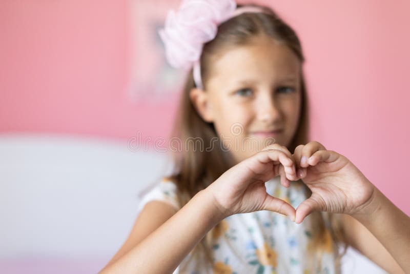 Girl showing a heart stock photo. Image of female, beautiful - 251768606