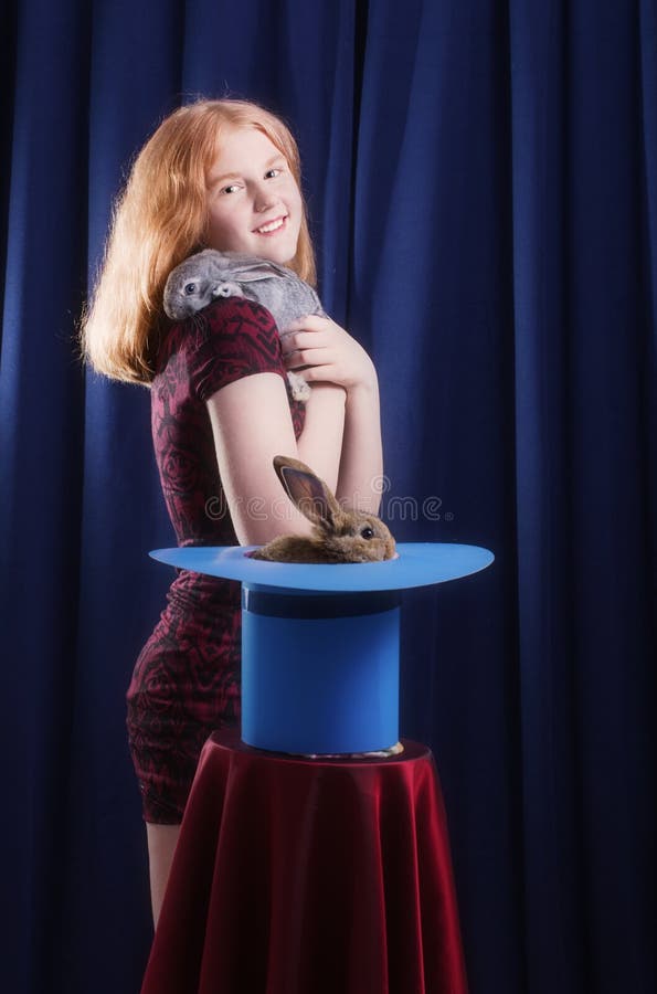 Girl Shows Focus with a Rabbit in a Hat Stock Photo - Image of ...