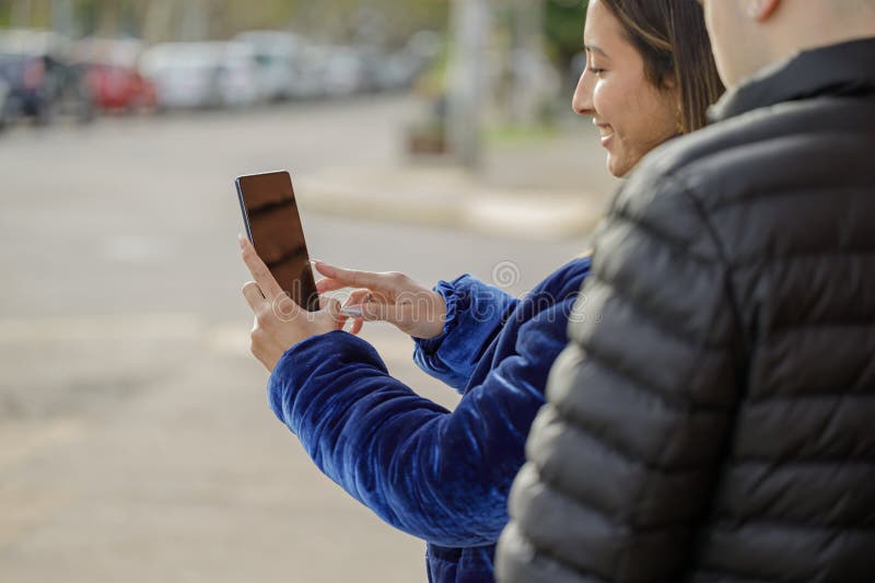 Girl Shows Her Mobile Phone To a Guy Stock Image - Image of ...