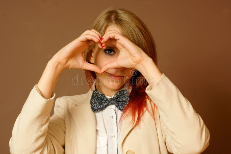 Girl Shows a Symbol of Love Stock Photo - Image of model, white: 26949042