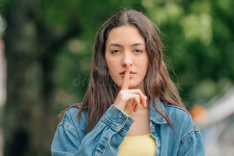 Girl with silence sign stock image. Image of noise, silent - 256051579