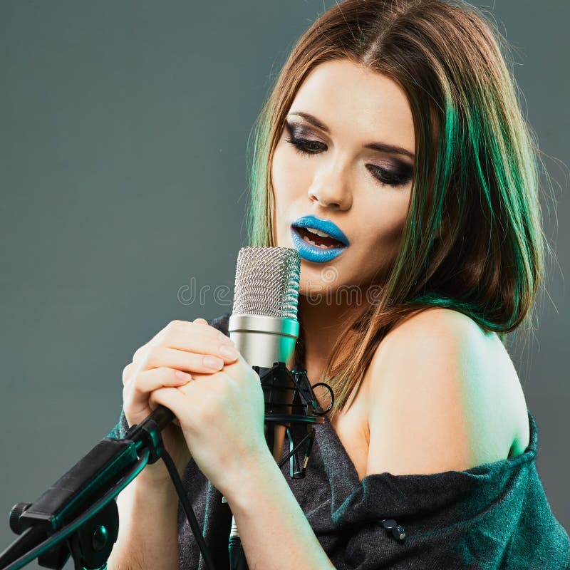 Girl Singing into a Microphone. Stock Image - Image of beauty, face ...