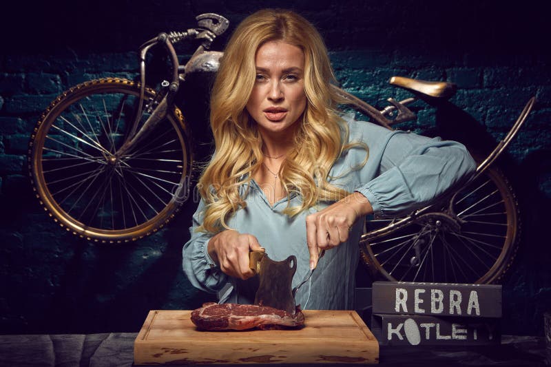 The Girl Eats Meat in a Restaurant. Expressive Stock Image - Image of ...