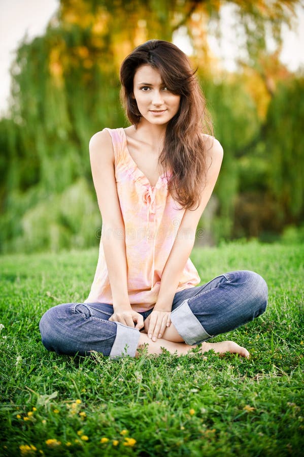 Girl sits on lawn stock image. Image of nature, lotus - 15437233