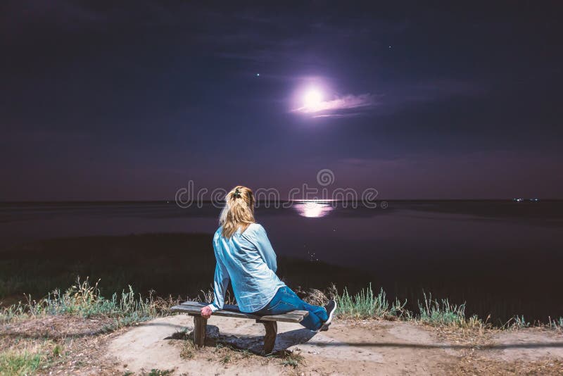 A Girl Sits by the Sea at Night Under the Moon Stock Image - Image of ...