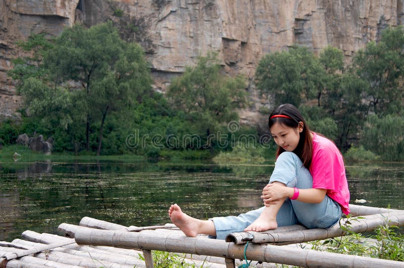 Girl Sitting on Bamboo Raft Stock Image - Image of girls, harmony: 3886285
