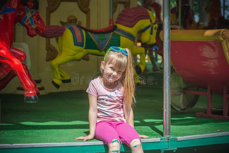 Girl Sitting on the Carousel Stock Photo - Image of festival, girl ...