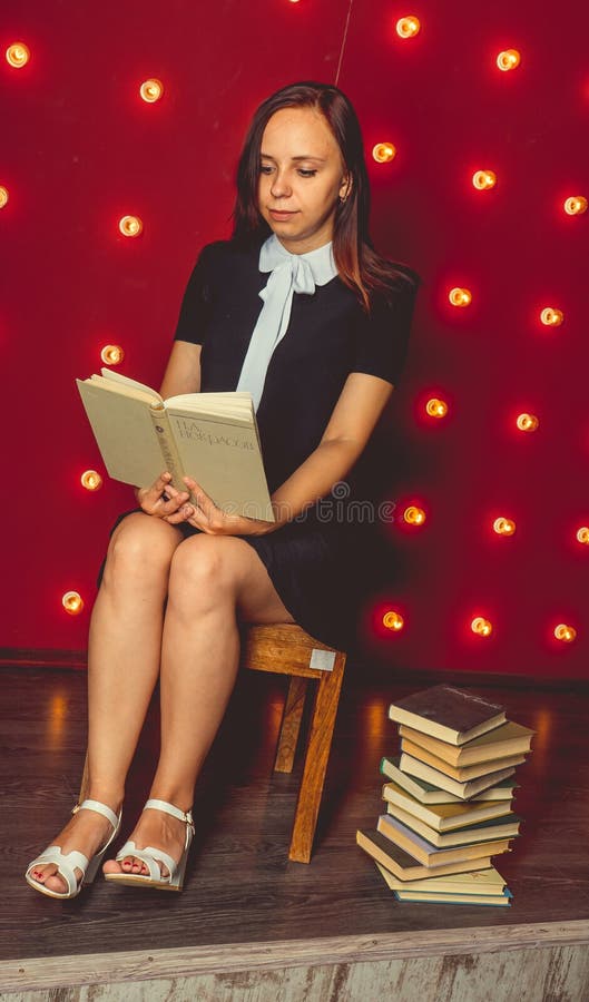 Girl Sitting on Chair and Reading a Book Stock Photo - Image of read ...